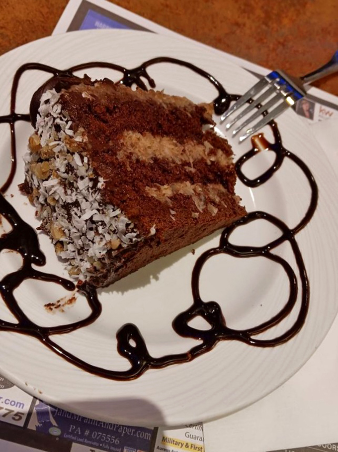 This slice of German chocolate cake isn't just dessert—it's therapy on a plate, with chocolate layers and coconut frosting playing the roles of your therapists.