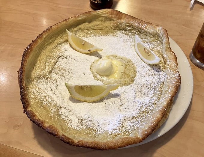 This powdered sugar-dusted German pancake with lemon wedges is what breakfast dreams are made of—part dessert, part morning miracle.