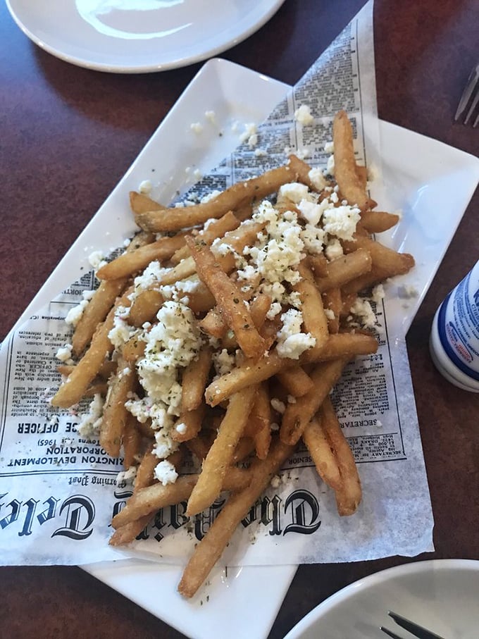 Greek fries topped with feta: where American comfort food and Mediterranean flair have a delicious little rendezvous.
