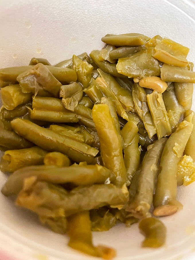 These green beans have clearly been simmering with purpose, absorbing flavors that transform them from simple vegetable to Southern statement piece.