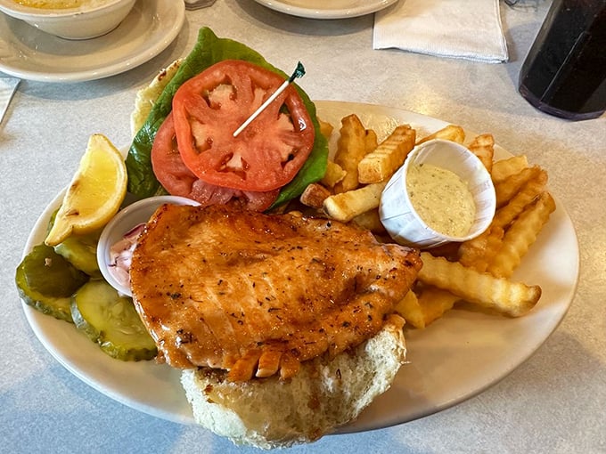 A fish sandwich that proves lunch at a breakfast joint isn't settling—it's discovering the diner's impressive range beyond the morning hours.