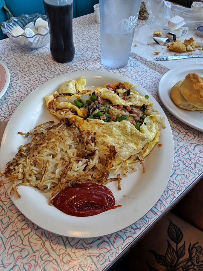 This omelet doesn't just contain ingredients—it showcases them, like a proud parent displaying photos of exceptionally talented children.