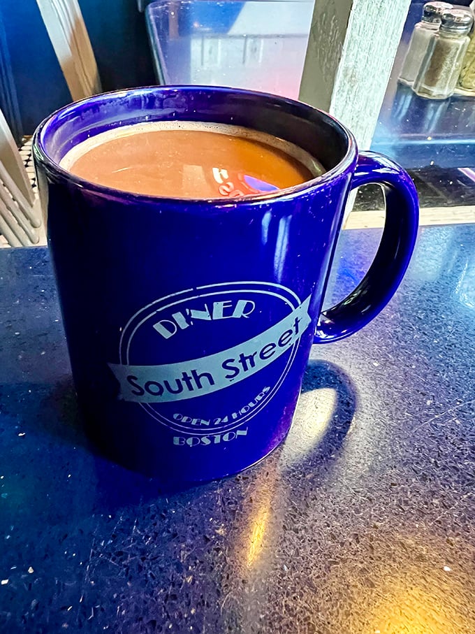 The blue mug isn't just a vessel—it's a promise that this coffee will actually taste like something worth waking up for.