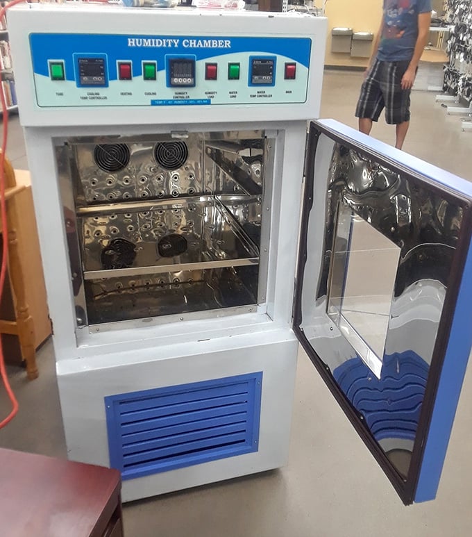 A humidity chamber appears like an alien artifact among household goods – proof that one person's specialized equipment is another's conversation piece.