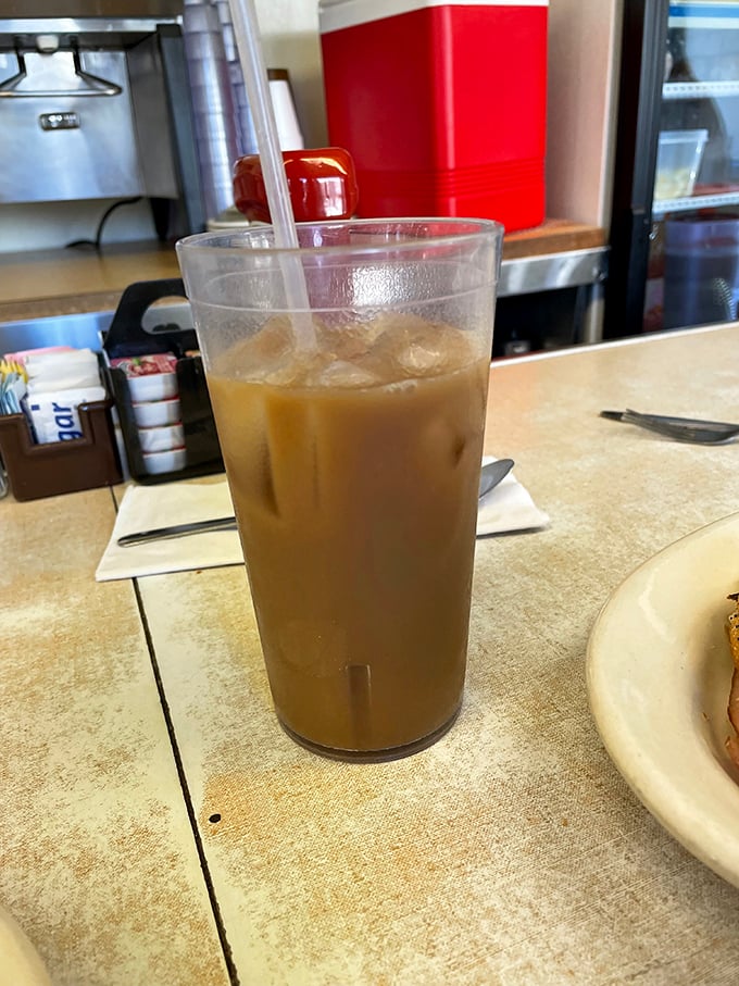 Coffee with that perfect caramel hue—the kind that promises to transform morning zombies into functioning humans with remarkable efficiency.