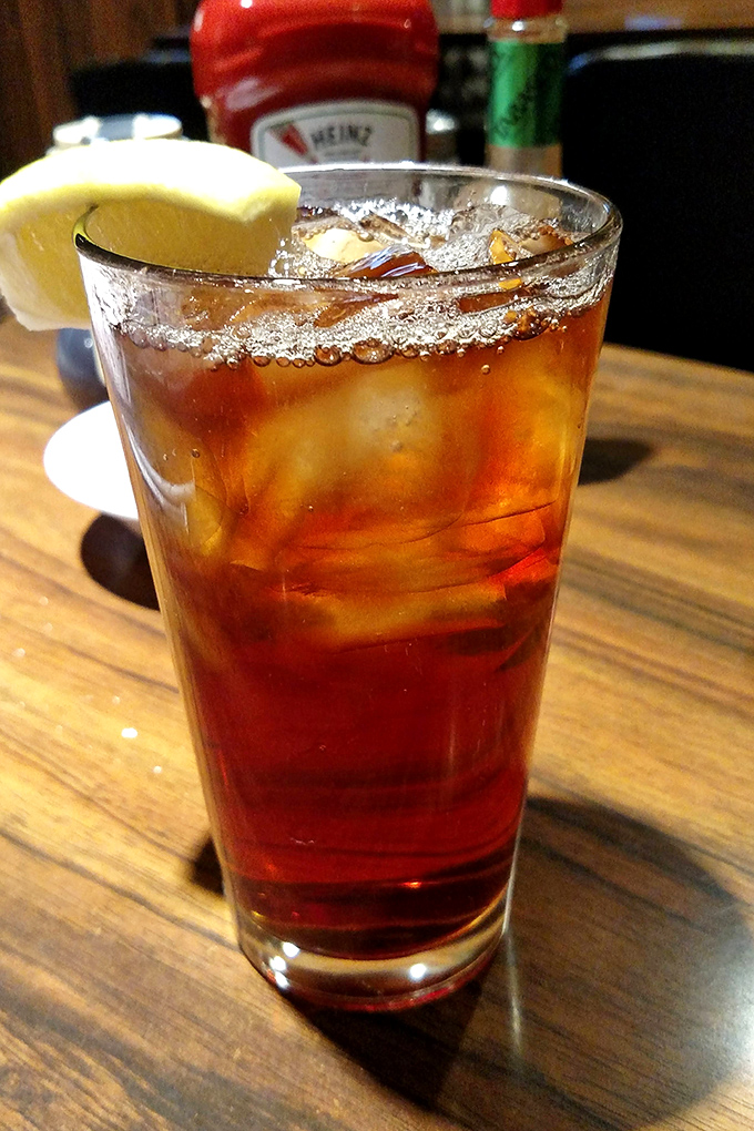 An amber glass of iced tea with a lemon wedge – the unofficial state beverage of Southern California and perfect companion to any meal.