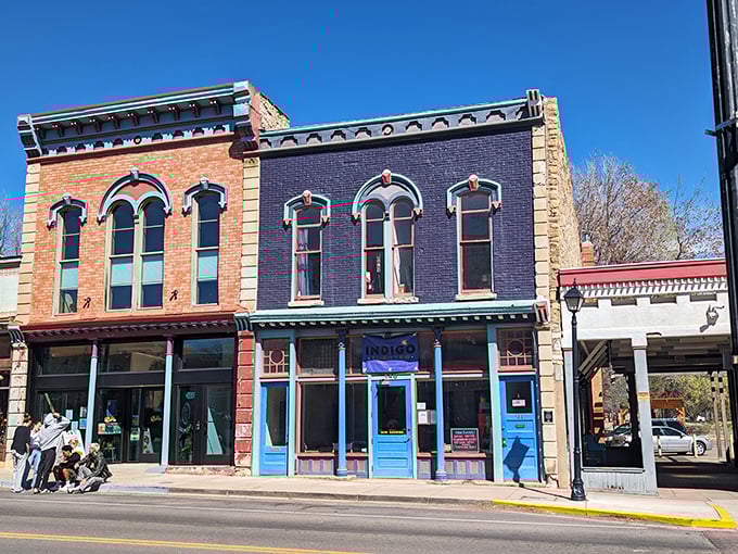 The Indigo Theatre's colorful historic façade promises entertainment without big-city ticket prices, a cultural touchstone in this affordable community.