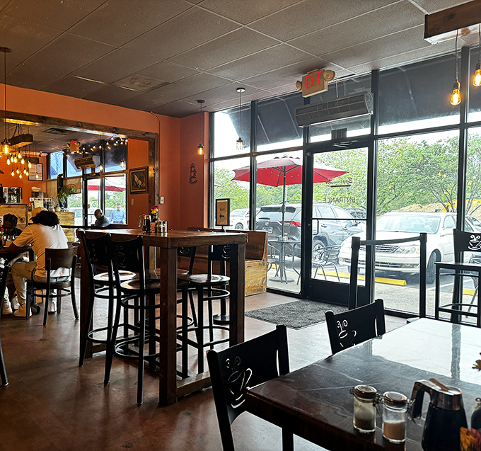 Tall windows flood the space with natural light, while cozy seating invites lingering conversations. The perfect backdrop for breakfast diplomacy.