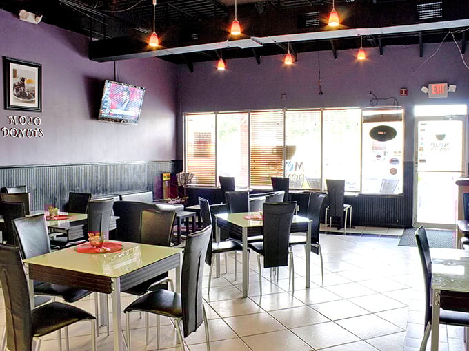 More purple walls, comfortable seating, and enough space to actually enjoy your haul without feeling rushed out.