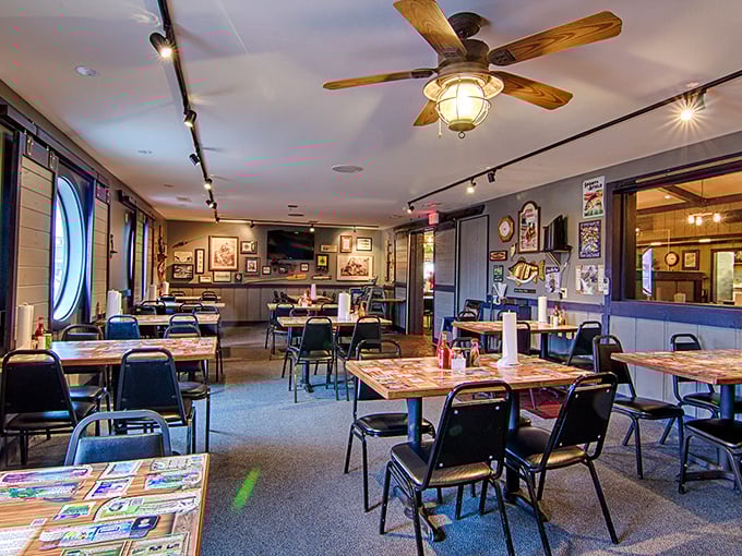 The dining room feels like a community living room where strangers become neighbors over shared appreciation of perfectly fried seafood.