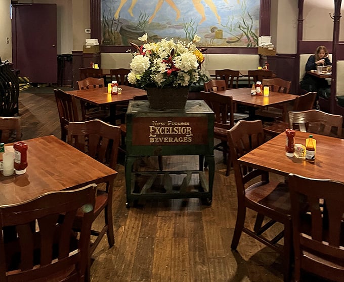 The dining room's understated elegance features a vintage beverage cart centerpiece—Southern hospitality in its natural habitat.