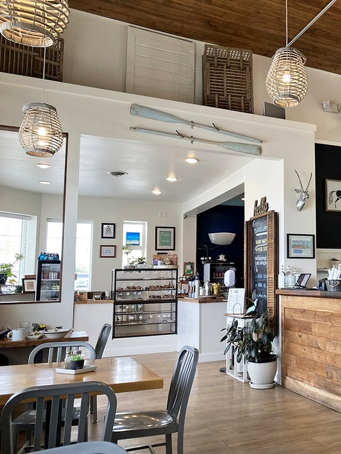Bright, airy, and thoughtfully designed—the bakery corner showcases homemade treats while potted plants add touches of green to the clean aesthetic.