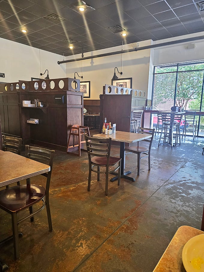 The quiet corner where early birds catch both worms and peaceful moments before the breakfast rush transforms the space into a buzzing hive of activity.