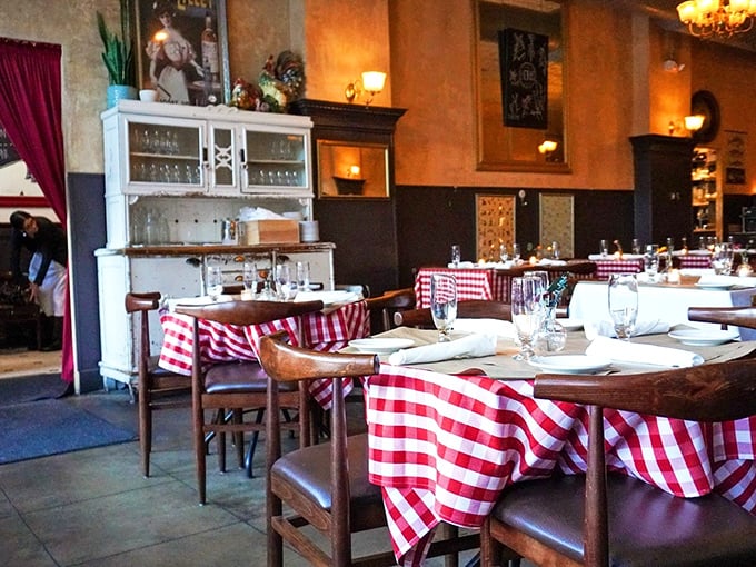 Every corner tells a story at Brasserie. The vintage hutch and red-checkered tables create that rare atmosphere where memories are made before the food even arrives.