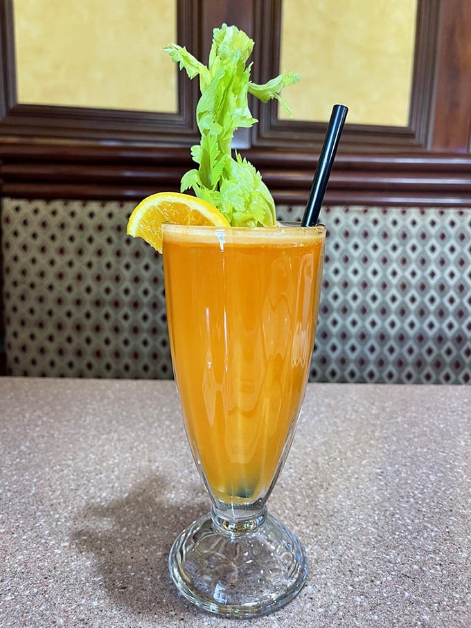 A sunrise in a glass – fresh juice garnished with celery and orange that makes you feel virtuous even as you contemplate ordering that side of bacon.