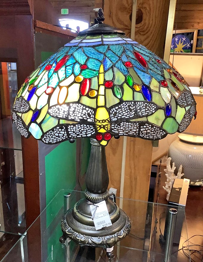 This Tiffany-style dragonfly lamp doesn't just illuminate a room – it transforms it into a stained-glass sanctuary of color.