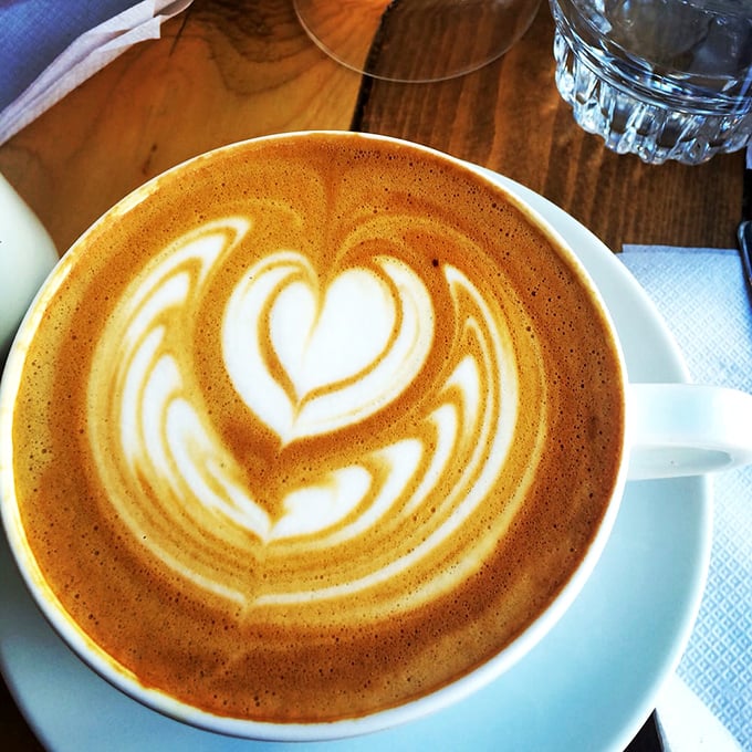 Latte art that's almost too pretty to drink—almost. The heart pattern whispers, "Take a picture first, then enjoy every sip."