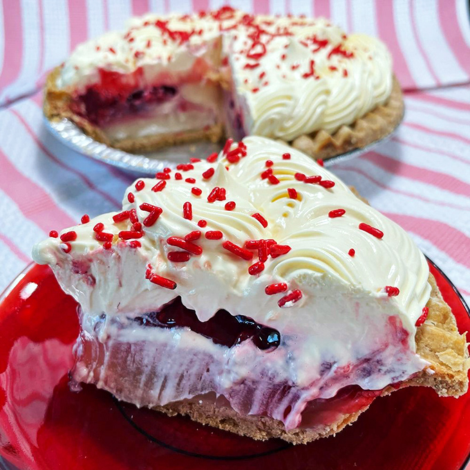 Layer upon layer of creamy, fruity bliss topped with festive sprinkles. This isn't just dessert—it's a celebration on a plate.