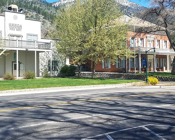 The Genoa Fire Department stands ready beside historic buildings, their classic architecture telling stories of frontier determination and community spirit.