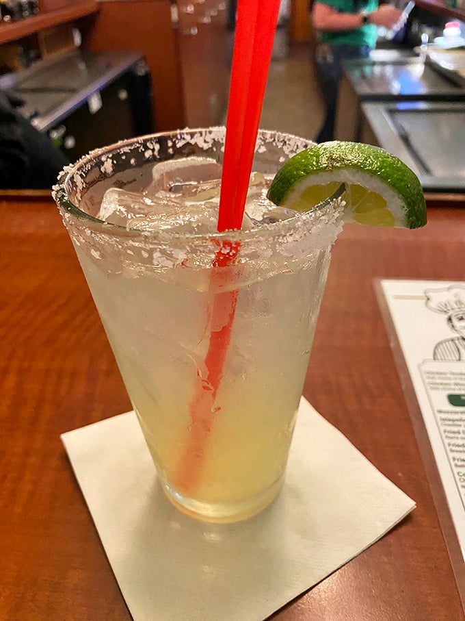 A properly salted rim, fresh lime, and that perfect clarity—this margarita isn't just a drink, it's your vacation waiting in a glass.