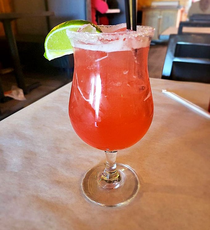 A salt-rimmed margarita with lime – the perfect cooling counterpoint to the spicy seafood feast that awaits.