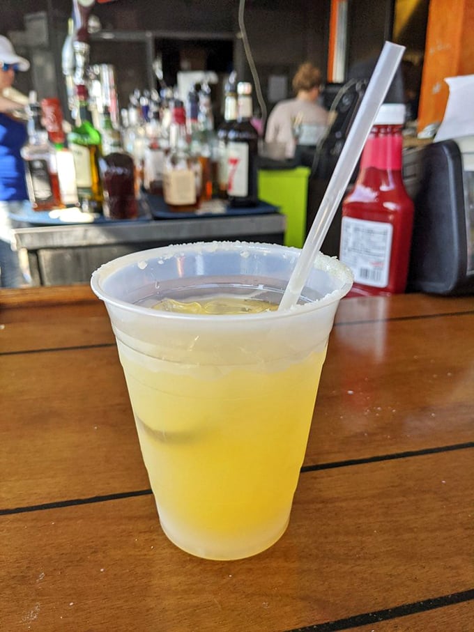 Nothing complements lake views like a frosty margarita. The salt rim isn't just garnish – it's essential seasoning for your afternoon relaxation.
