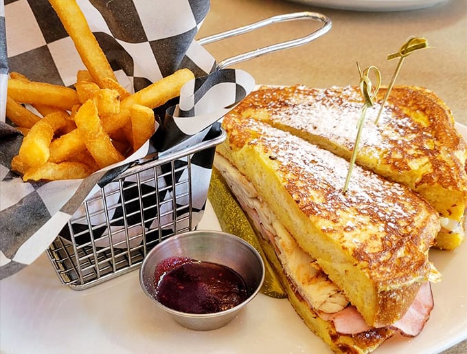 The Monte Cristo: where breakfast and lunch have a delicious affair, resulting in French toast stuffed with ham and cheese, served with fries.