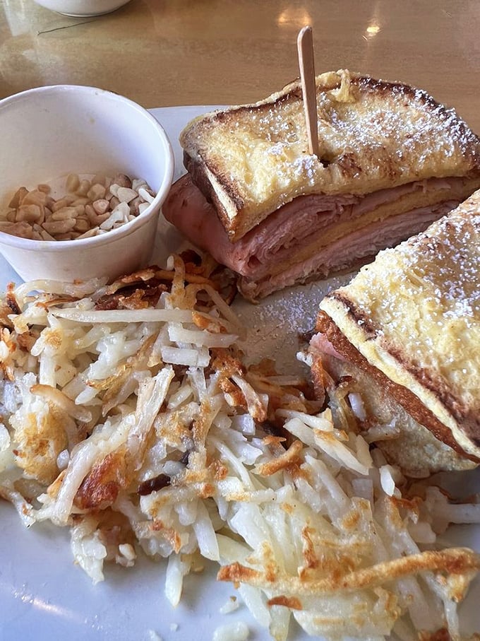 The Monte Cristo: French toast meets ham and cheese in a powdered sugar love affair. It's breakfast, it's lunch, it's dessert—it's everything.