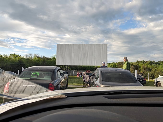 The blank screen awaits dusk's arrival, standing tall against Tennessee's rolling hills—cinema's most patient performer ready for its nightly star turn.
