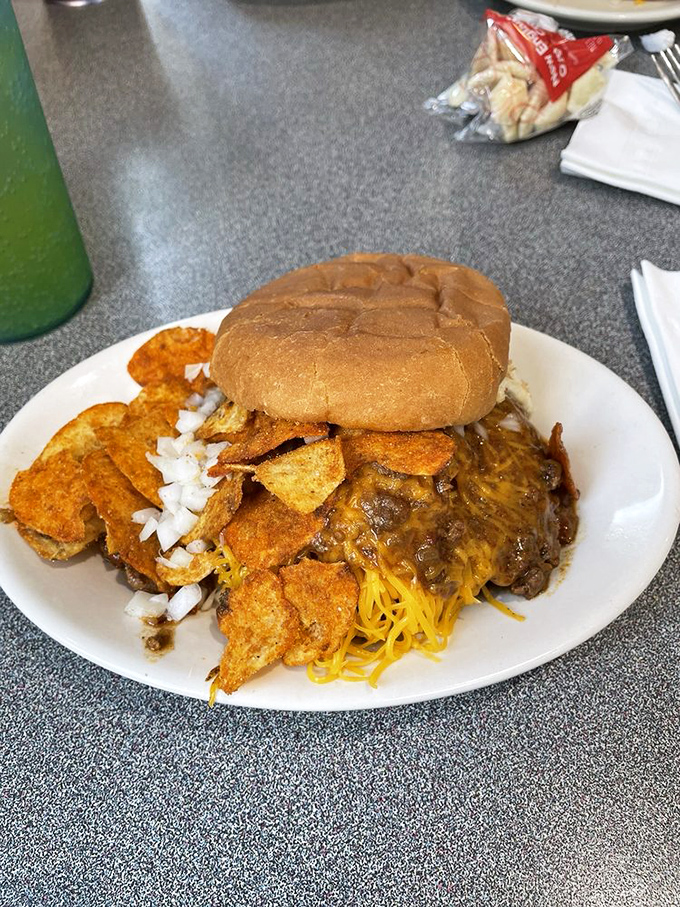 The Nati Burger breaks all the rules—chili-drenched, cheese-covered, and flanked by chips like delicious bodyguards. Diet plans beware.
