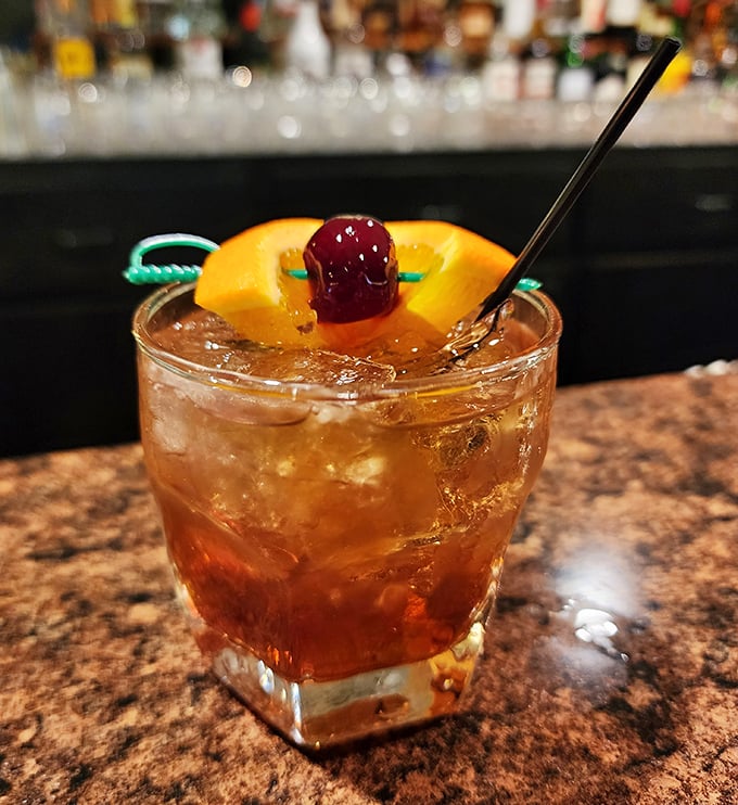 An Old Fashioned garnished with orange and cherry – because great Italian food deserves equally thoughtful cocktail companionship.