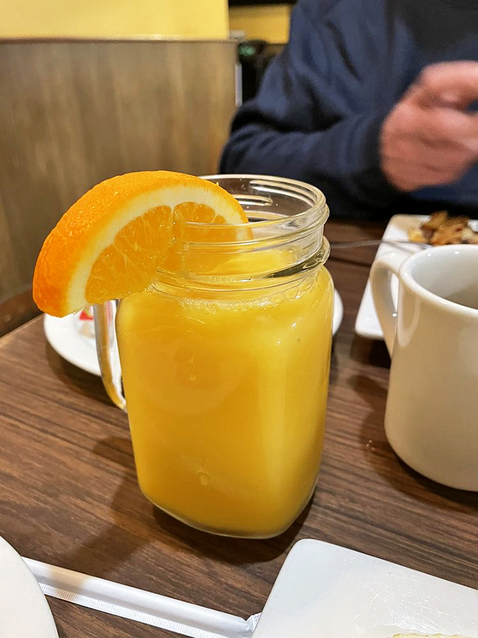 Fresh-squeezed orange juice in a mason jar – because sometimes the simplest pleasures are the most profound.