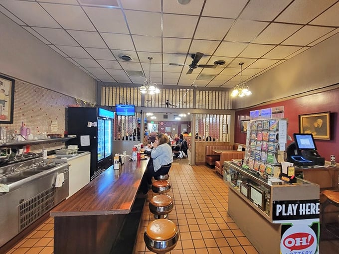 The counter view reveals the heart of the operation—where magic happens between grill and plate without unnecessary fanfare.