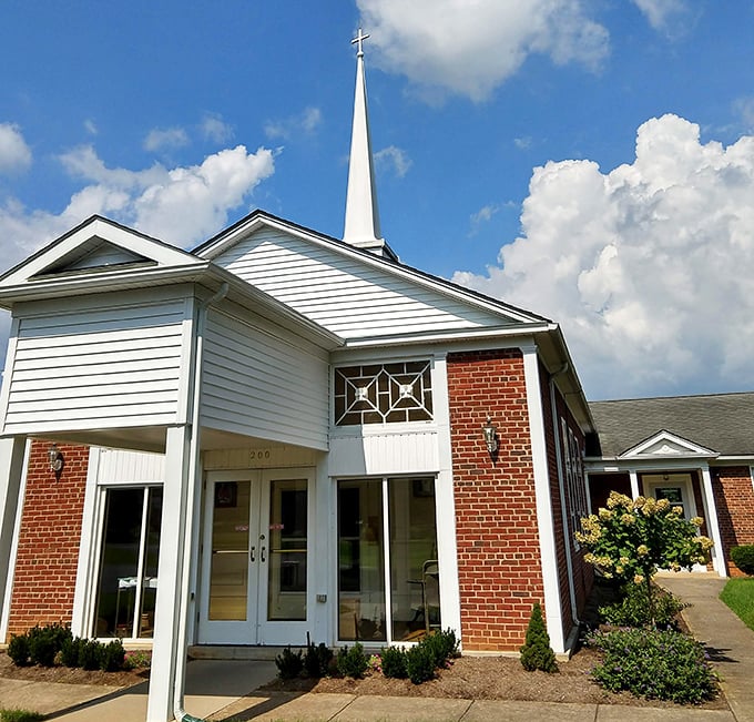 Community worship space where steeples reach toward heaven above rolling Virginia hills.