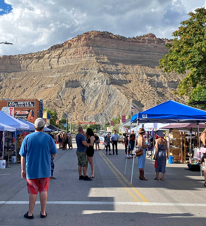 Helper's outdoor market transforms Main Street into a community living room, with those magnificent cliffs serving as Mother Nature's wallpaper.