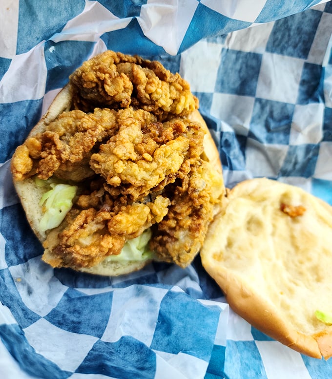 The oyster burger – where land meets sea in a handheld miracle. Briny, crispy, and utterly addictive.