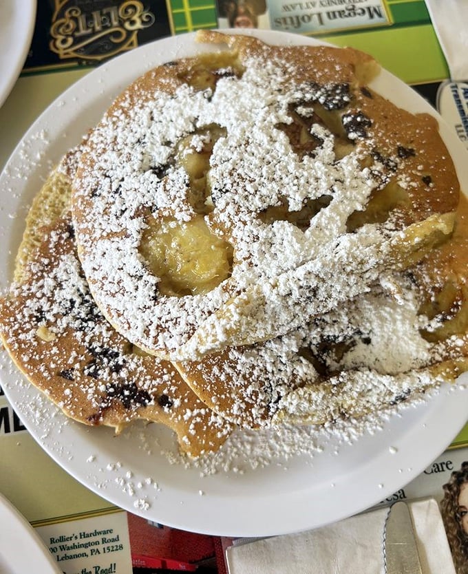 These pancakes don't just have powdered sugar—they're wearing delicious formal attire for their grand entrance to your taste buds.