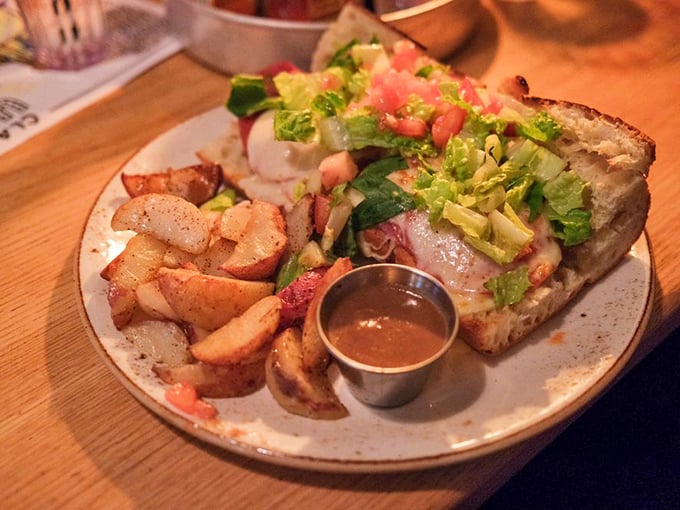 A sandwich that demands to be eaten with both hands and a stack of napkins. Worth every delicious, messy bite.