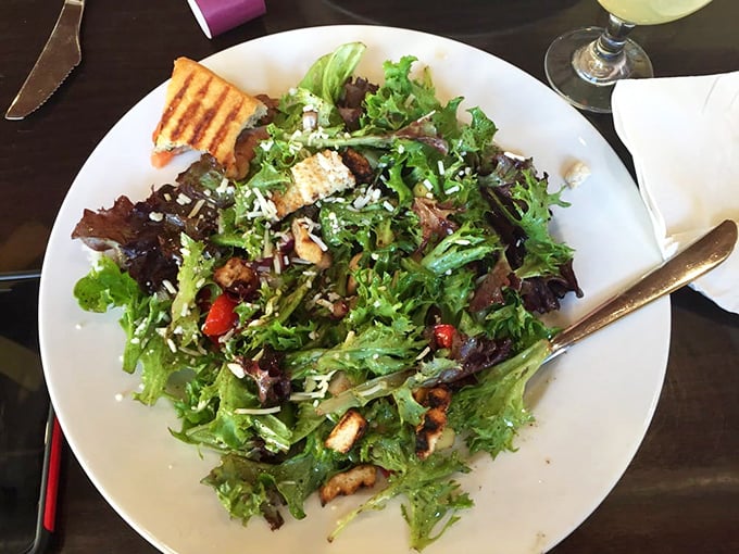This salad isn't what you eat before the main event—it IS the main event, with greens that actually taste like something.