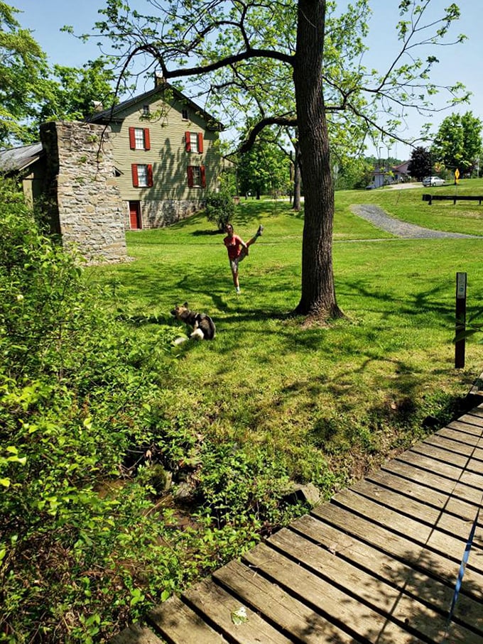 Historic buildings and playful poses—Little Buffalo welcomes both preservation and joy. Even the dog seems to approve of this arrangement.