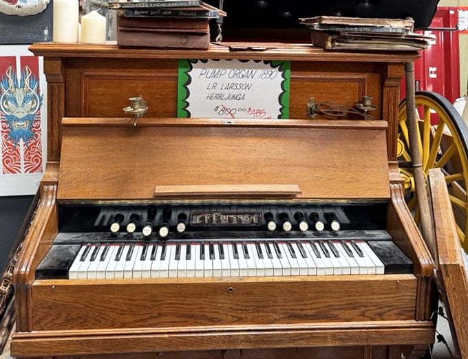 This pump organ isn't just furniture – it's a time machine waiting for fingers to press those ivory keys and release melodies from another century.