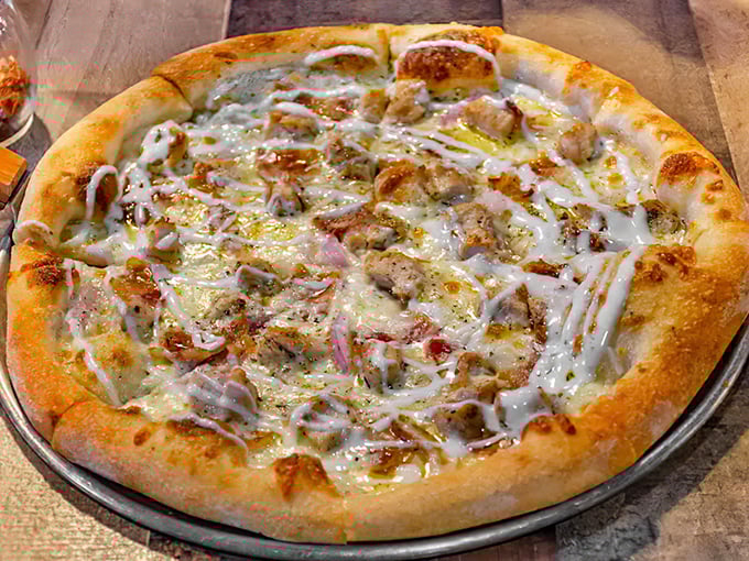 This isn't just pizza – it's proof that small-town diners can surprise you. Cheese stretching to infinity and toppings in perfect harmony.