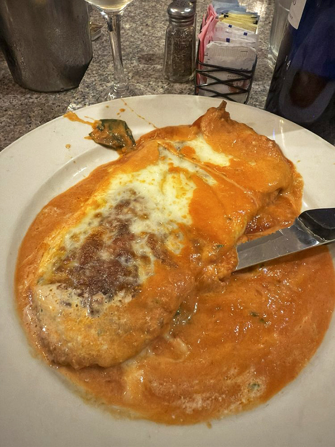 Chicken Parmigiana that doesn't just satisfy hunger—it creates memories, with cheese melted to perfection over a sea of vibrant sauce.