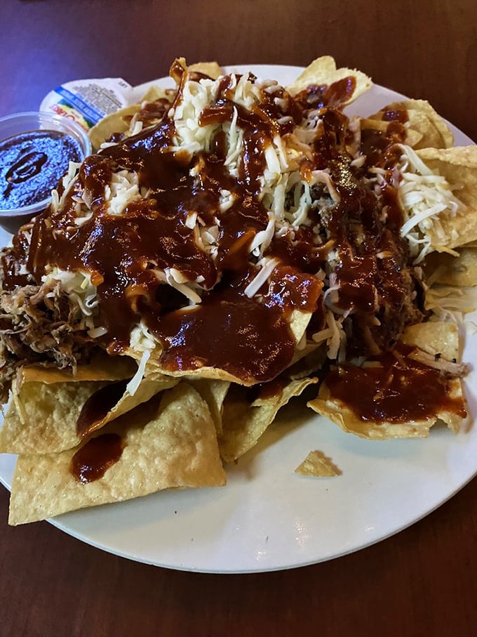 These pulled pork nachos aren't messing around—they're serious about that BBQ sauce relationship and they're not afraid to show it.