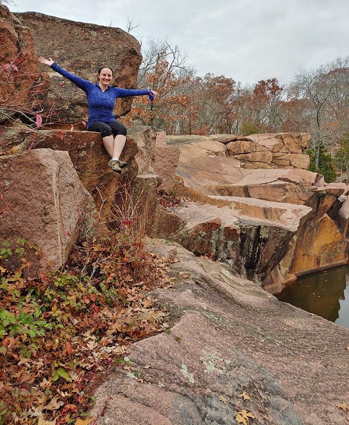 Victory perch! After conquering these ancient boulders, the triumphant pose comes naturally – geological achievement unlocked!