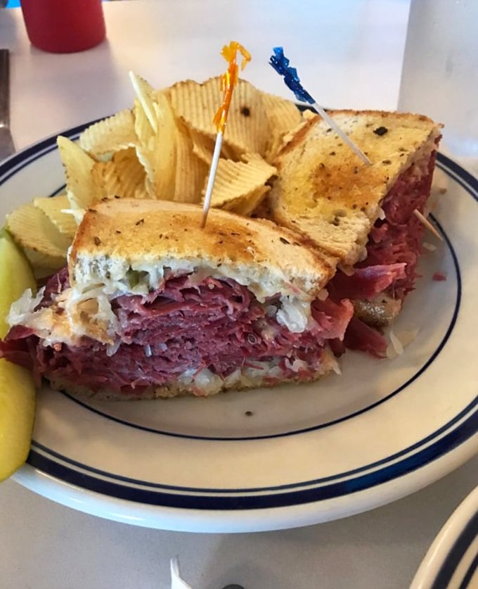 This Reuben sandwich isn't messing around – it's stacked higher than your weekend to-do list with enough corned beef to make Manhattan jealous.
