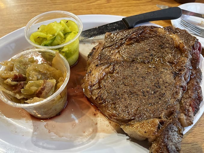 A steak that commands respect, flanked by pickle relish and caramelized onions – the culinary equivalent of a heavyweight with sophisticated friends.
