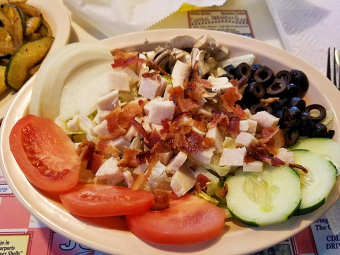 When a diner offers a proper salad, you know they understand balance—like how those bacon bits are technically a vegetable if you squint hard enough.