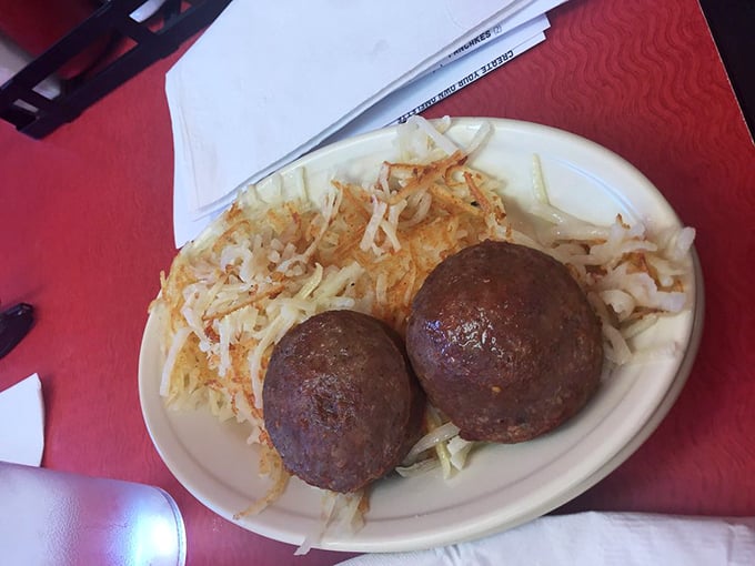 Two perfect breakfast ambassadors—sausage patties with golden hash browns. Simple, unpretentious, and exactly what you want at 8 AM.