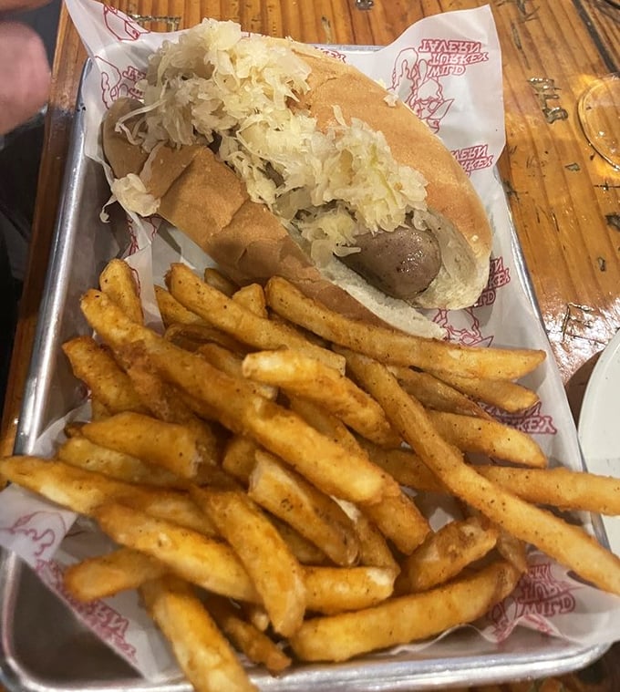This isn't just a sausage sandwich—it's a commitment. The sauerkraut adds a tangy crunch that transforms this from good to "where have you been all my life?"